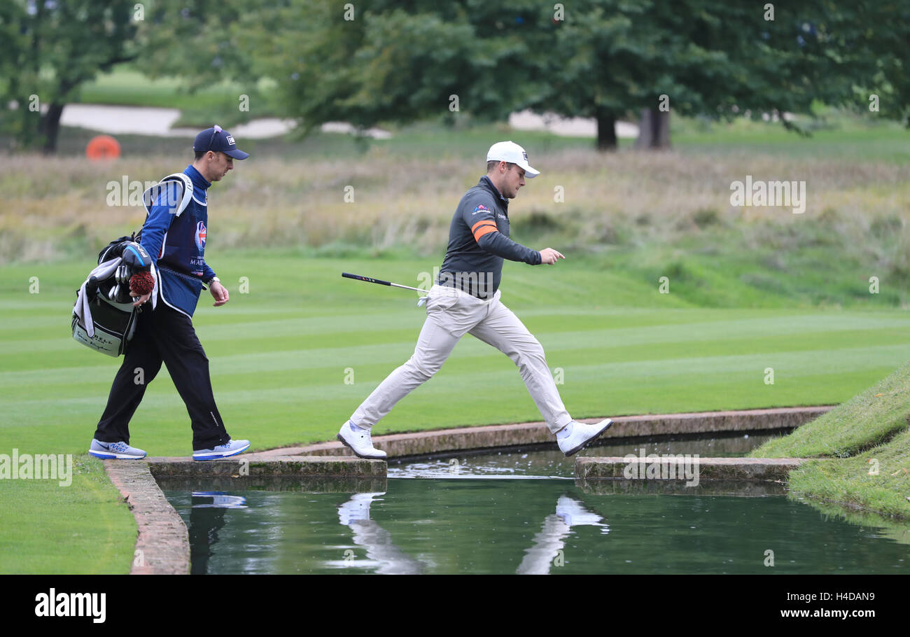 England's Tyrrell Hatton has to step over a gap in the path during day ...