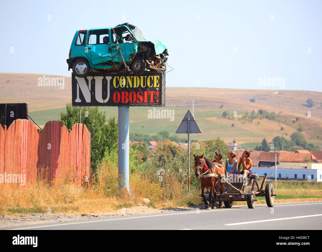 Traffic danger sign with mounted scrap vehicle Rupea Romania Stock ...