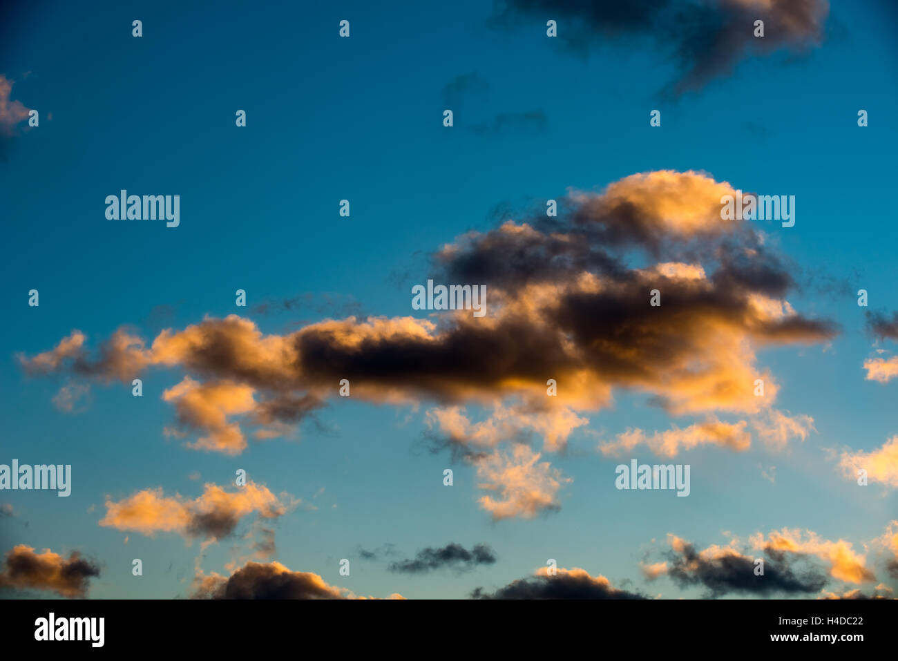 Puffy and colorful sunset clouds Stock Photo - Alamy