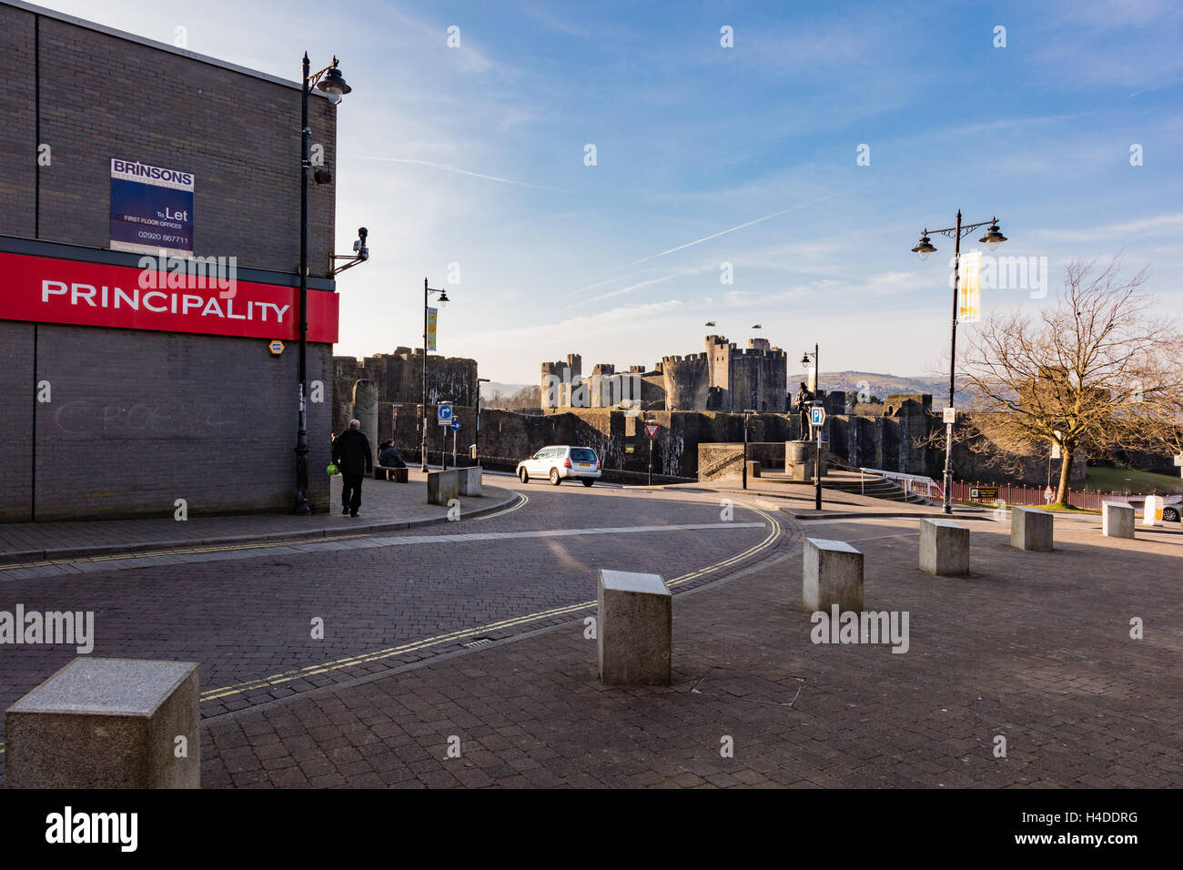 Caerphilly castle viewed from the town centre, with a signed ...