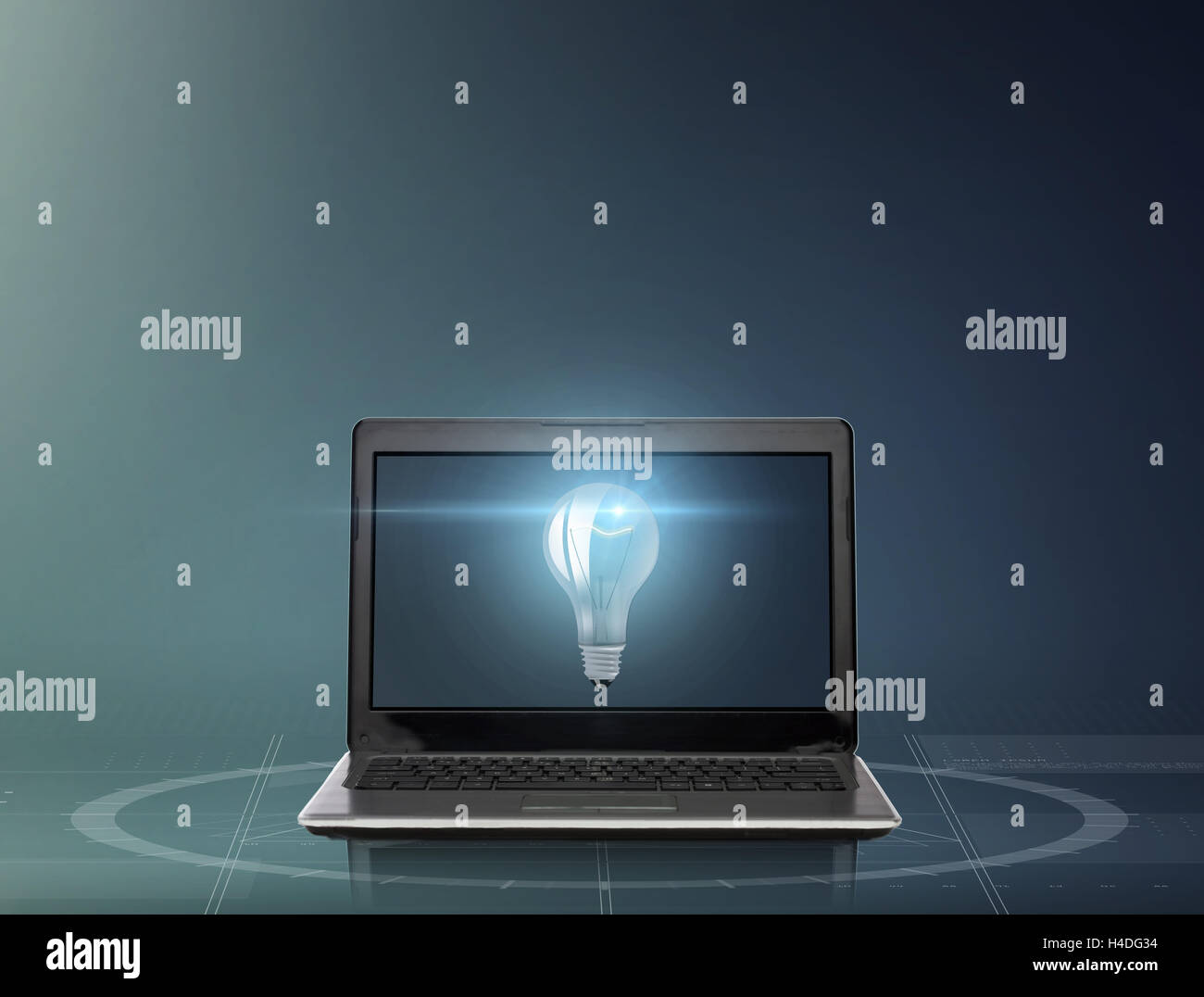 laptop computer with light bulb on screen Stock Photo - Alamy