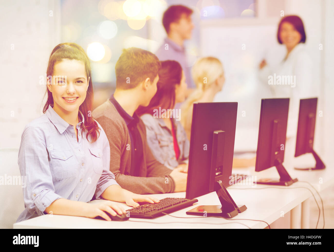 students with computer monitor at school Stock Photo - Alamy