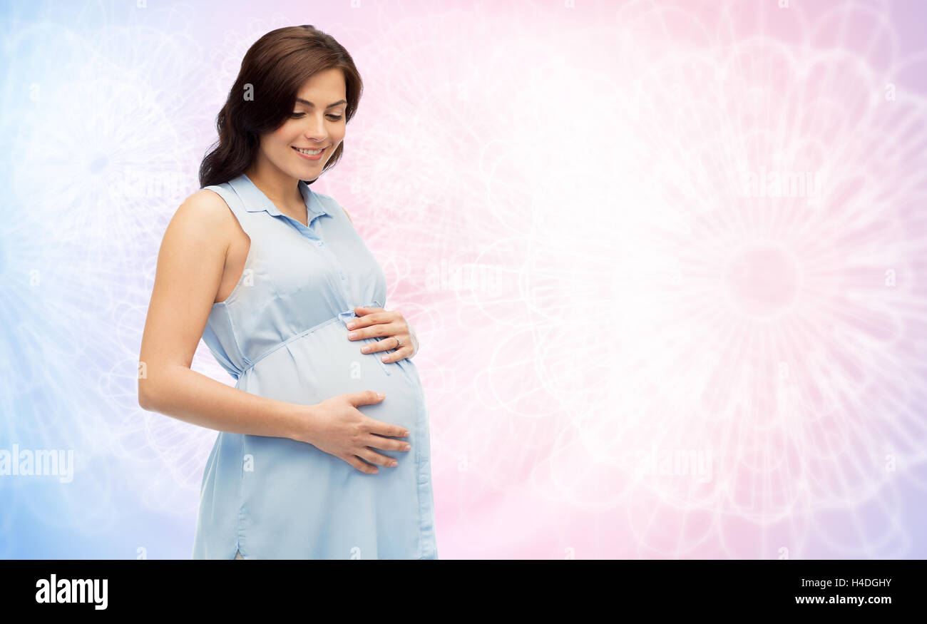 happy pregnant woman touching her big belly Stock Photo - Alamy