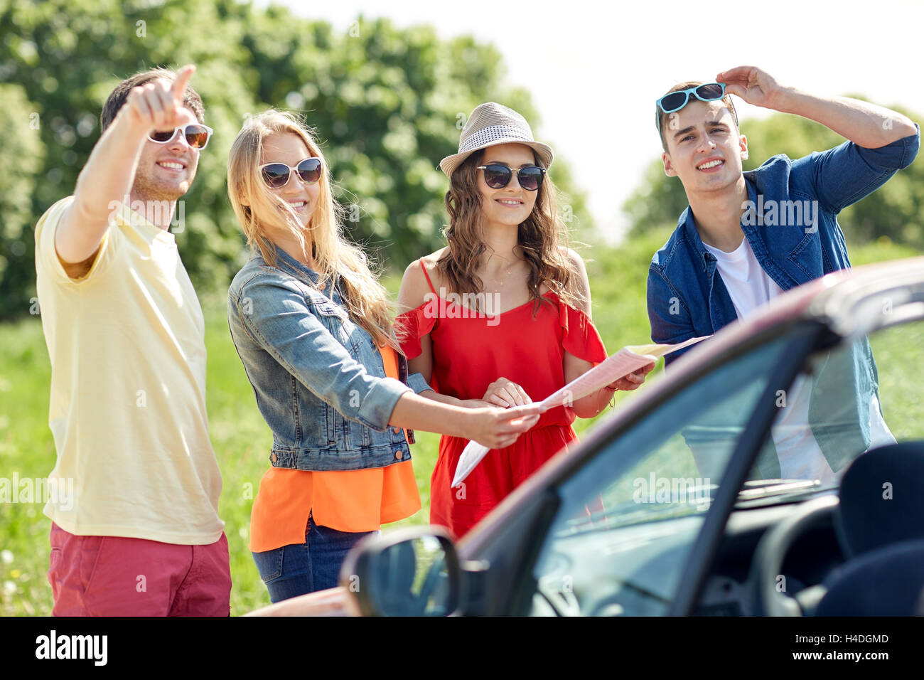 happy friends driving in cabriolet car Stock Photo - Alamy