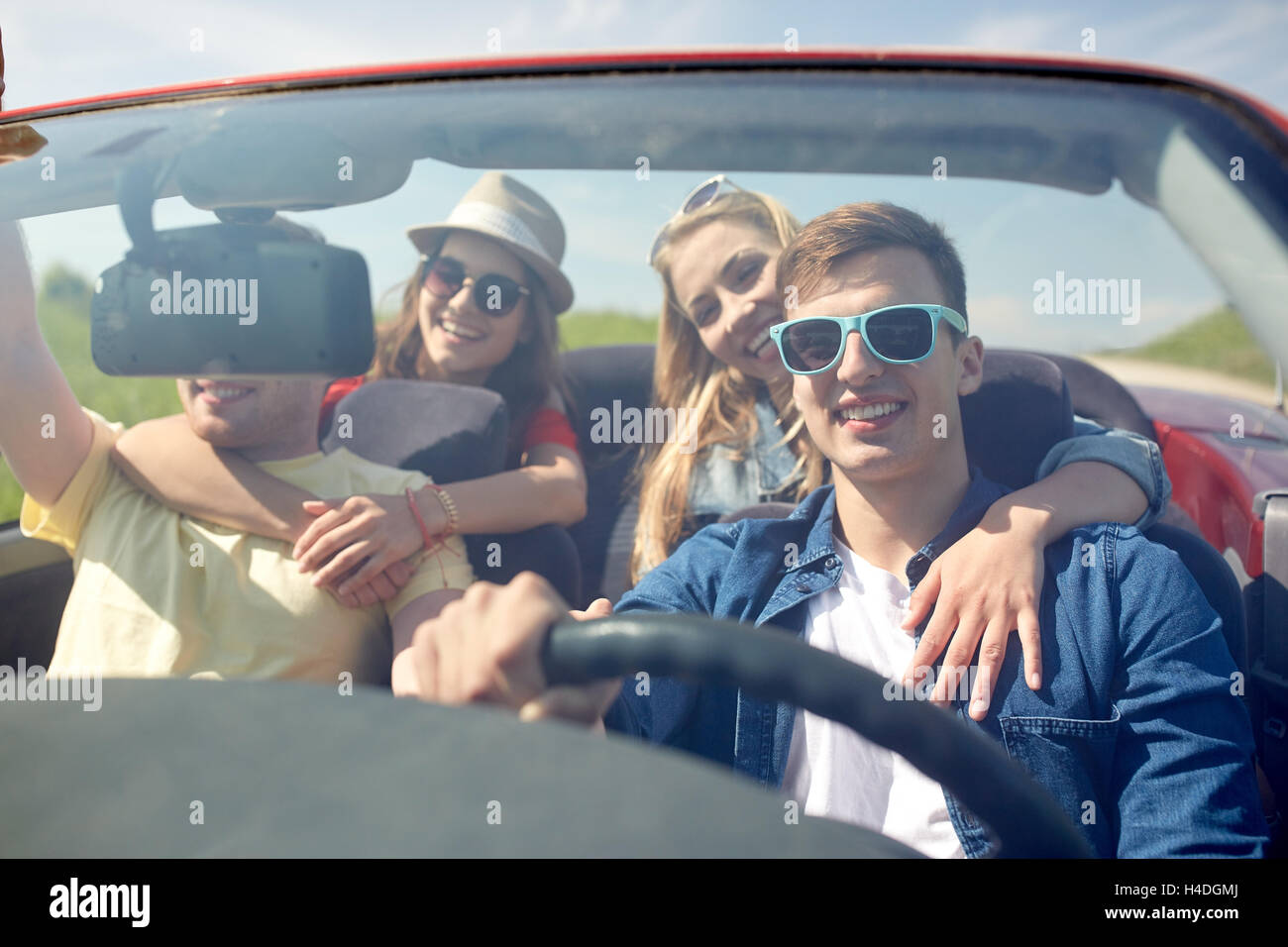 happy friends driving in cabriolet car outdoors Stock Photo - Alamy