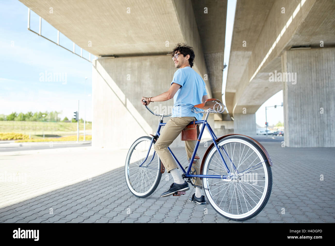 young hipster man riding fixed gear bike Stock Photo - Alamy