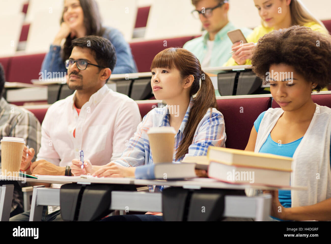 group of students with notebooks on lecture Stock Photo - Alamy