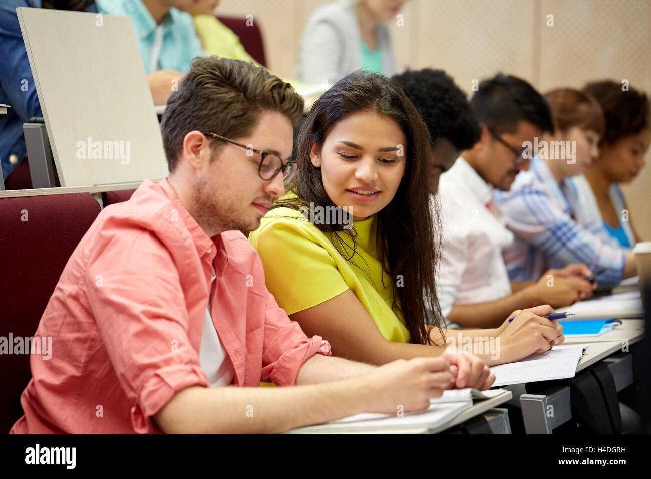 group of international students writing at lecture Stock Photo - Alamy