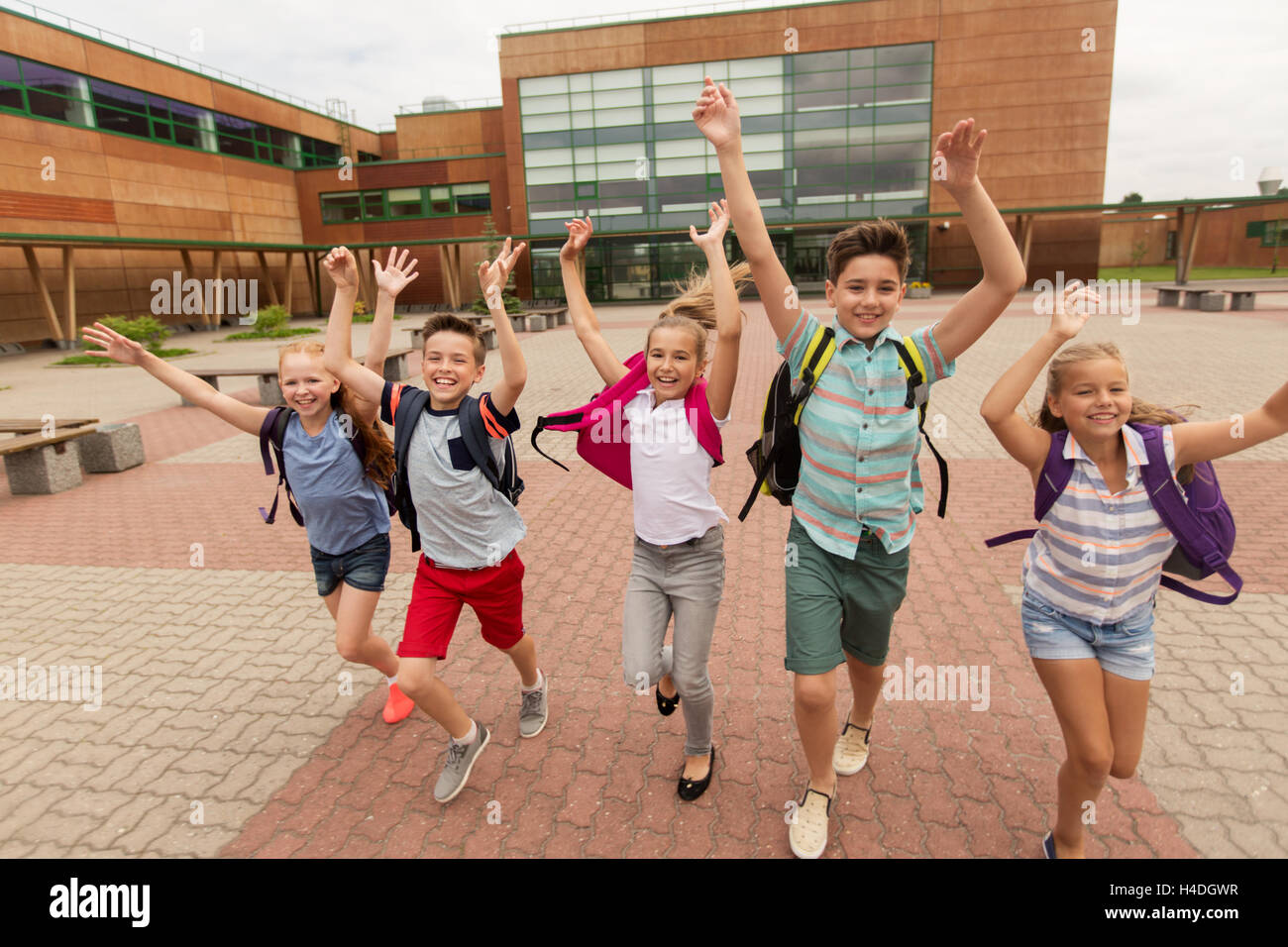 group of happy elementary school students running Stock Photo - Alamy