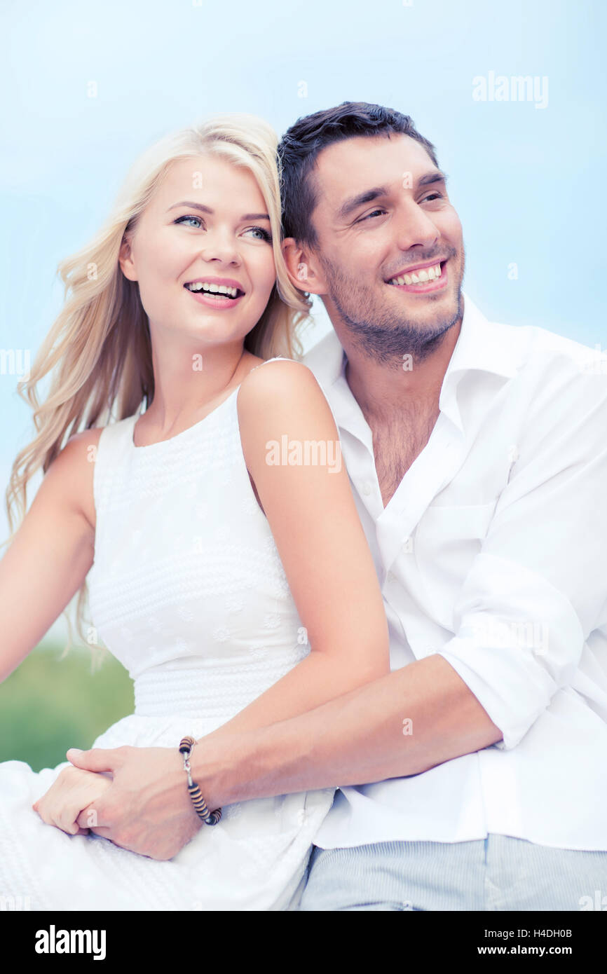 couple in shades at sea side Stock Photo - Alamy