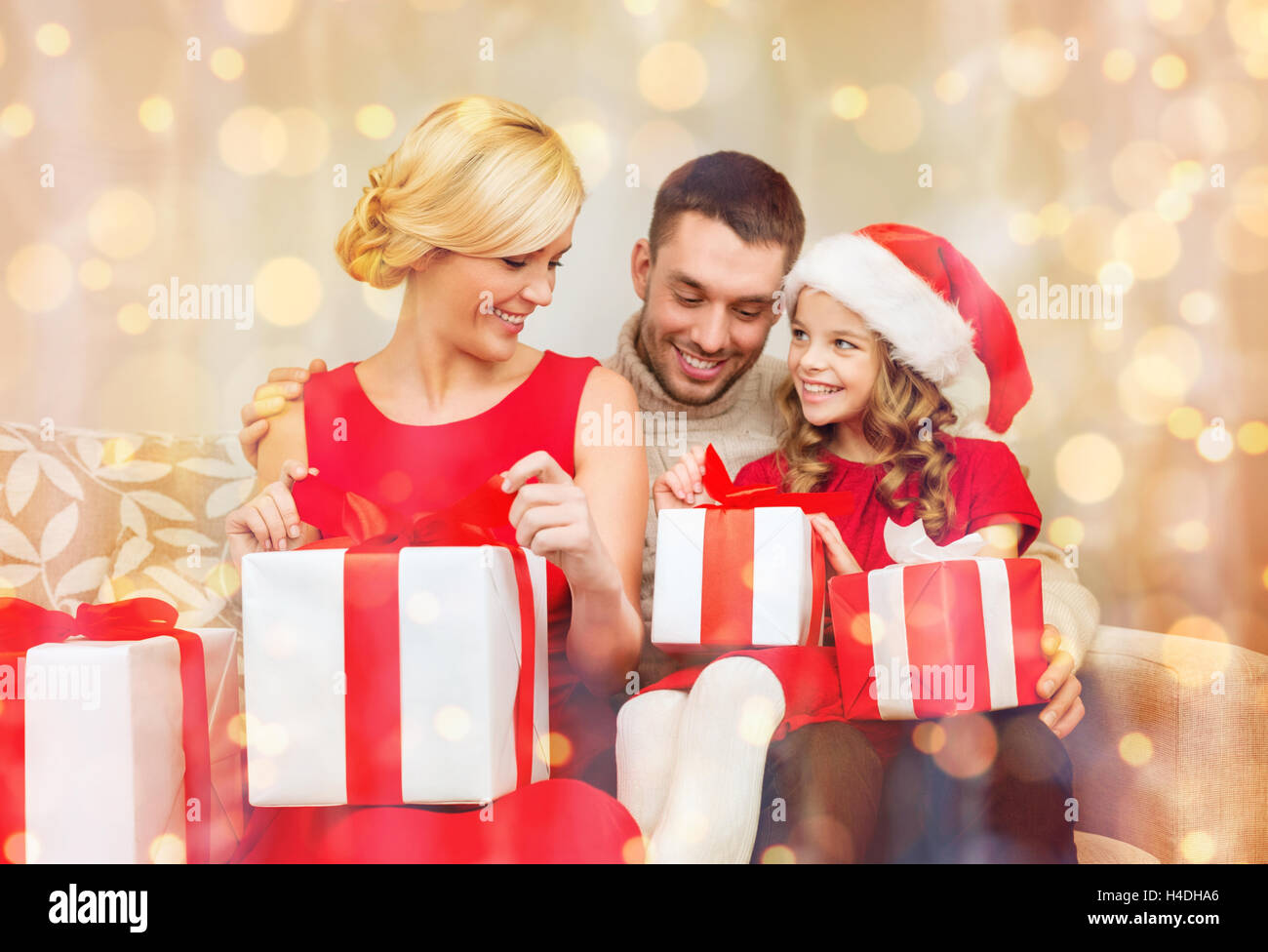 happy family opening gift boxes Stock Photo - Alamy