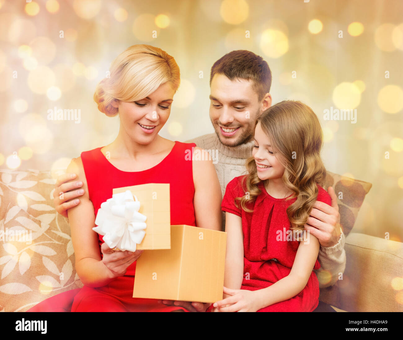 happy family opening gift box Stock Photo - Alamy
