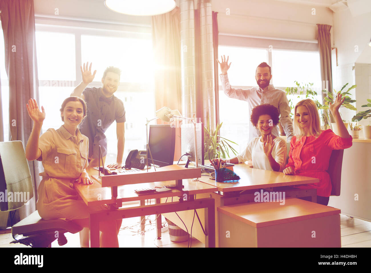 Waving hand to colleagues hi-res stock photography and images - Alamy