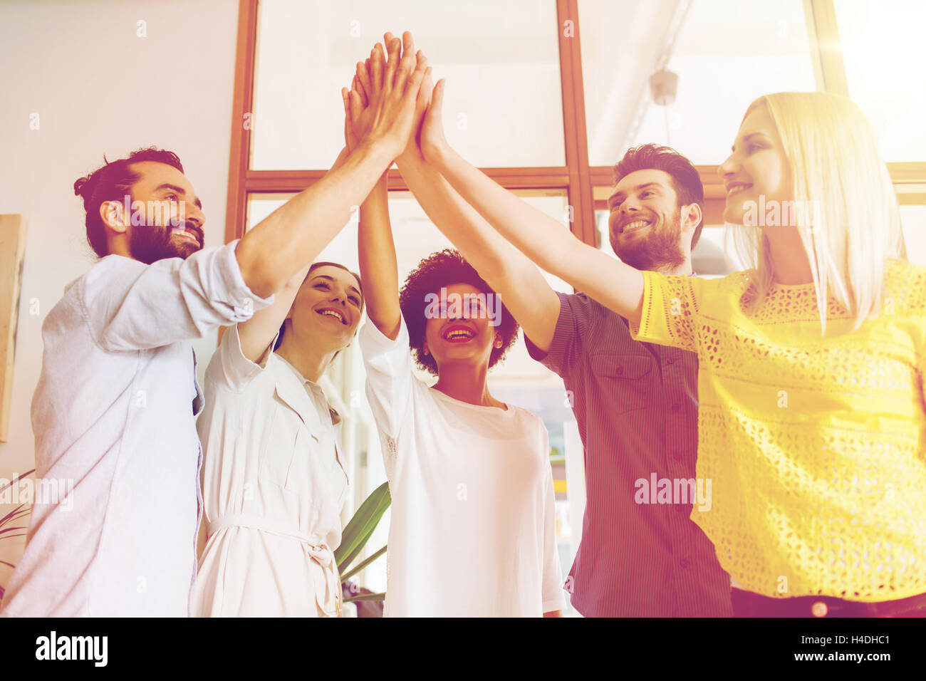 happy creative team in office Stock Photo - Alamy