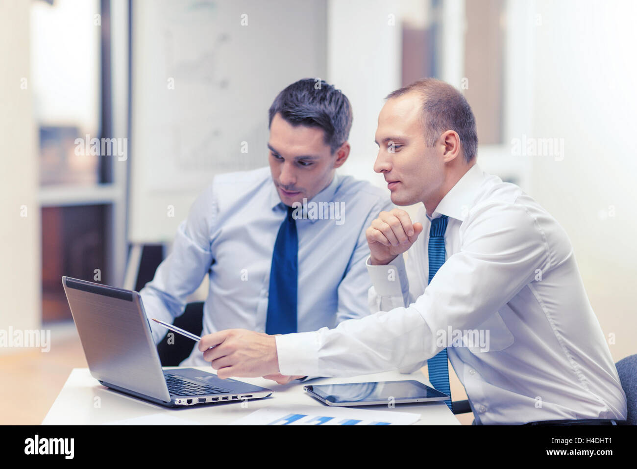 two businessmen having discussion in office Stock Photo - Alamy