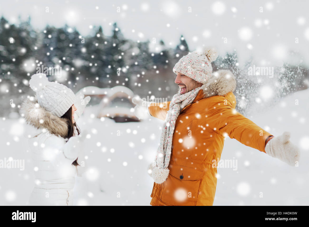happy couple playing with snow in winter Stock Photo - Alamy