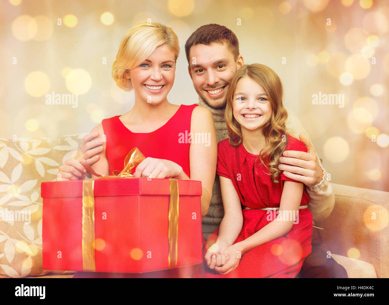 happy family opening gift box Stock Photo - Alamy