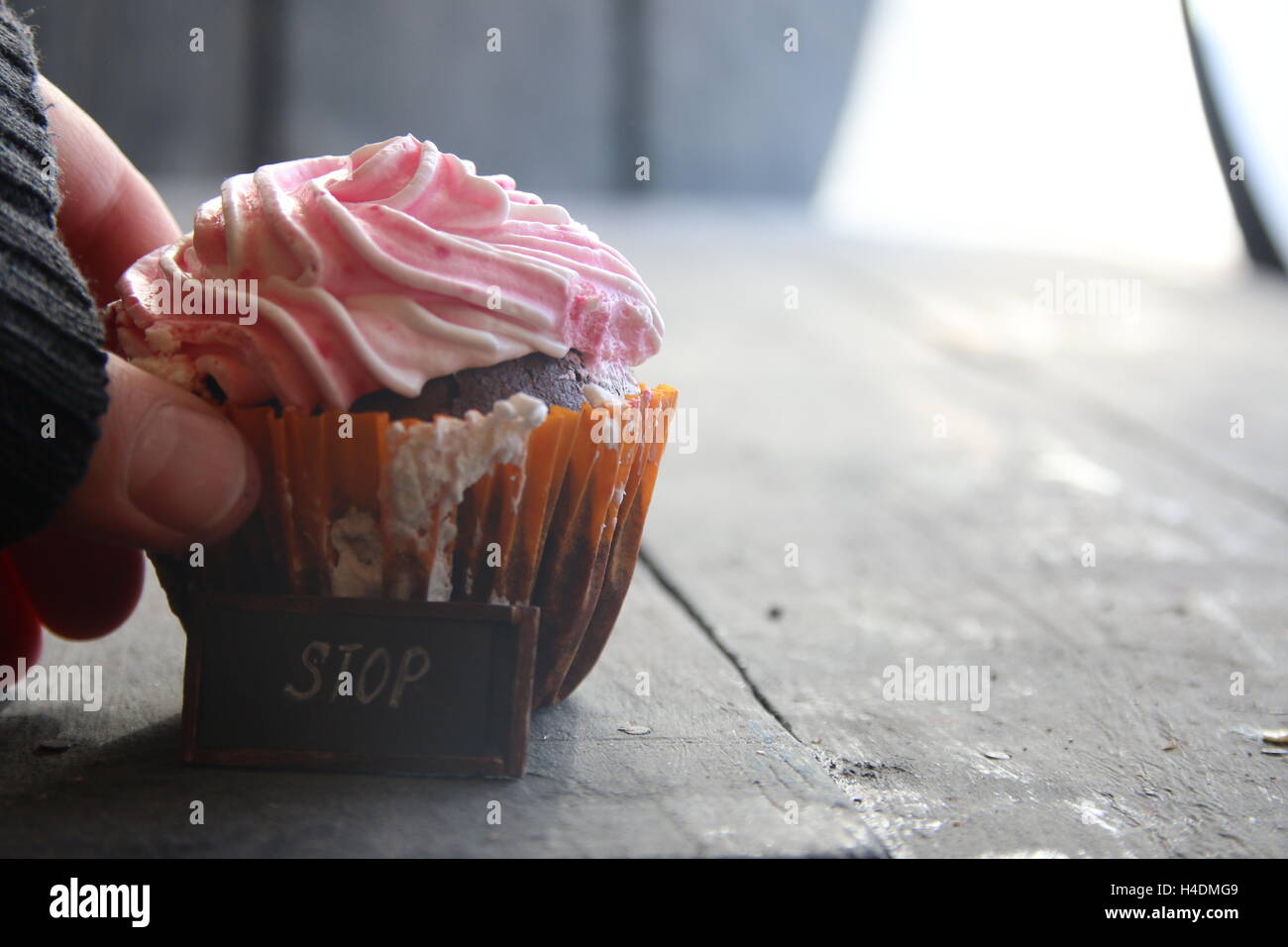 Cupcake, and text Stop - diet idea Stock Photo - Alamy