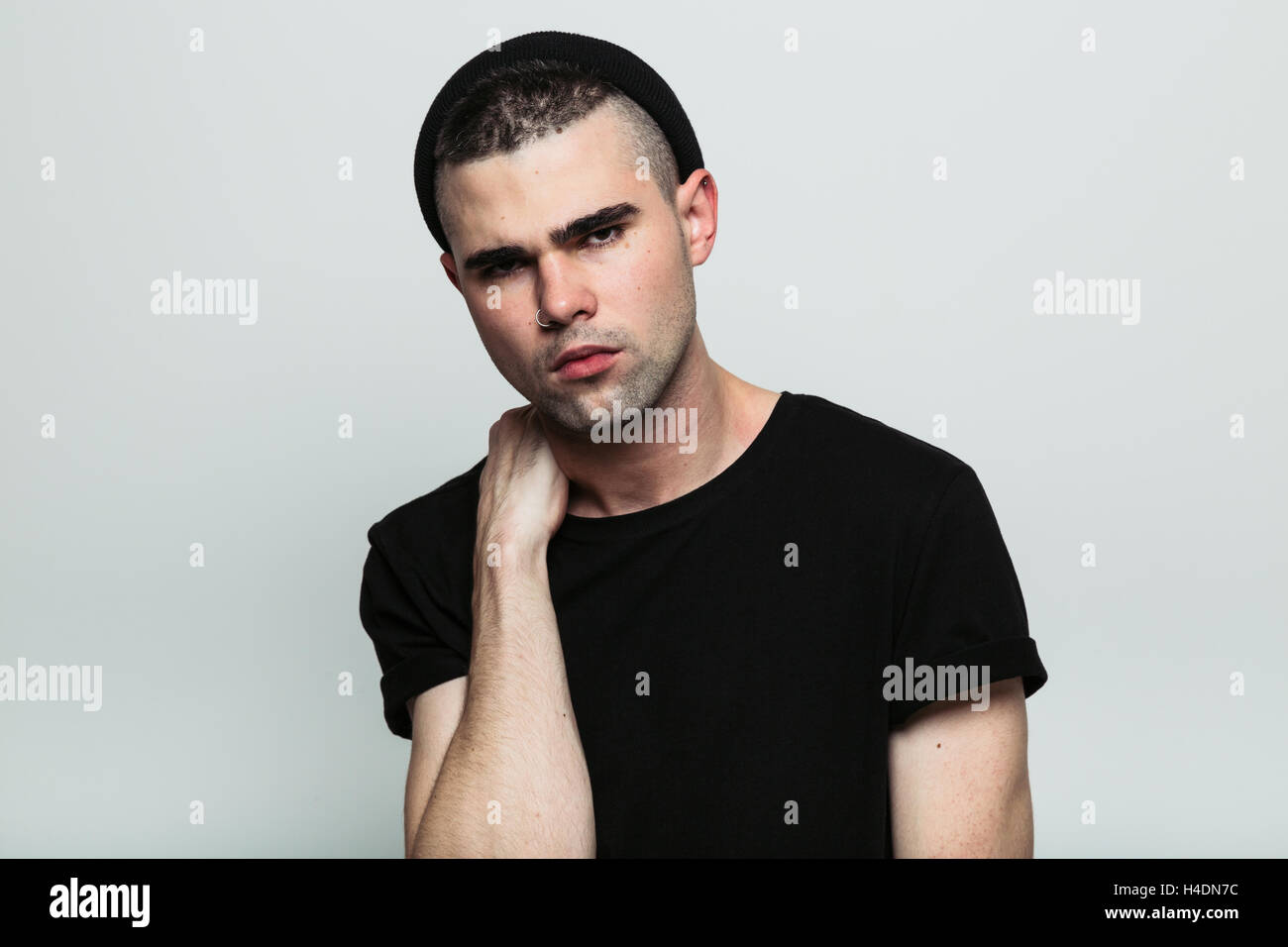 Portrait of serious man looking at camera Stock Photo - Alamy