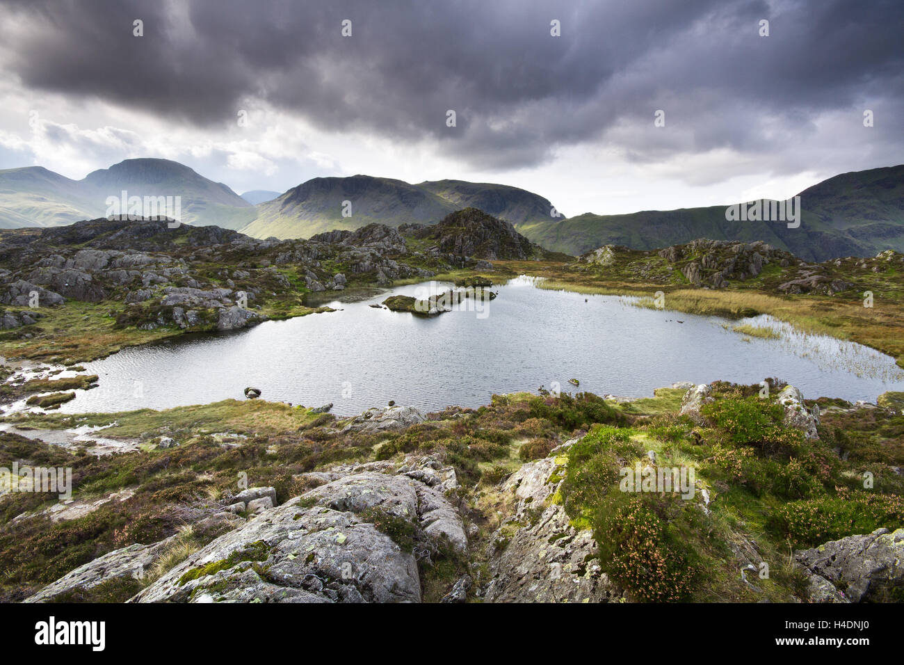 Innominate Tarn on Haystacks, looking across to surrounding mountains ...
