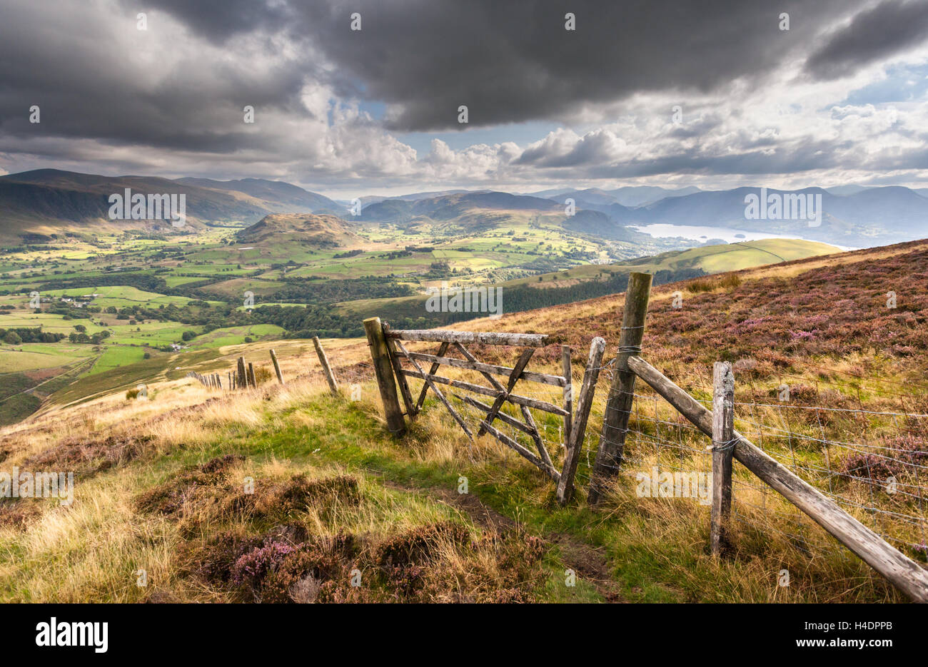 Old wooden gate and fence line on Lonscale Fell overlooking Keswick and ...
