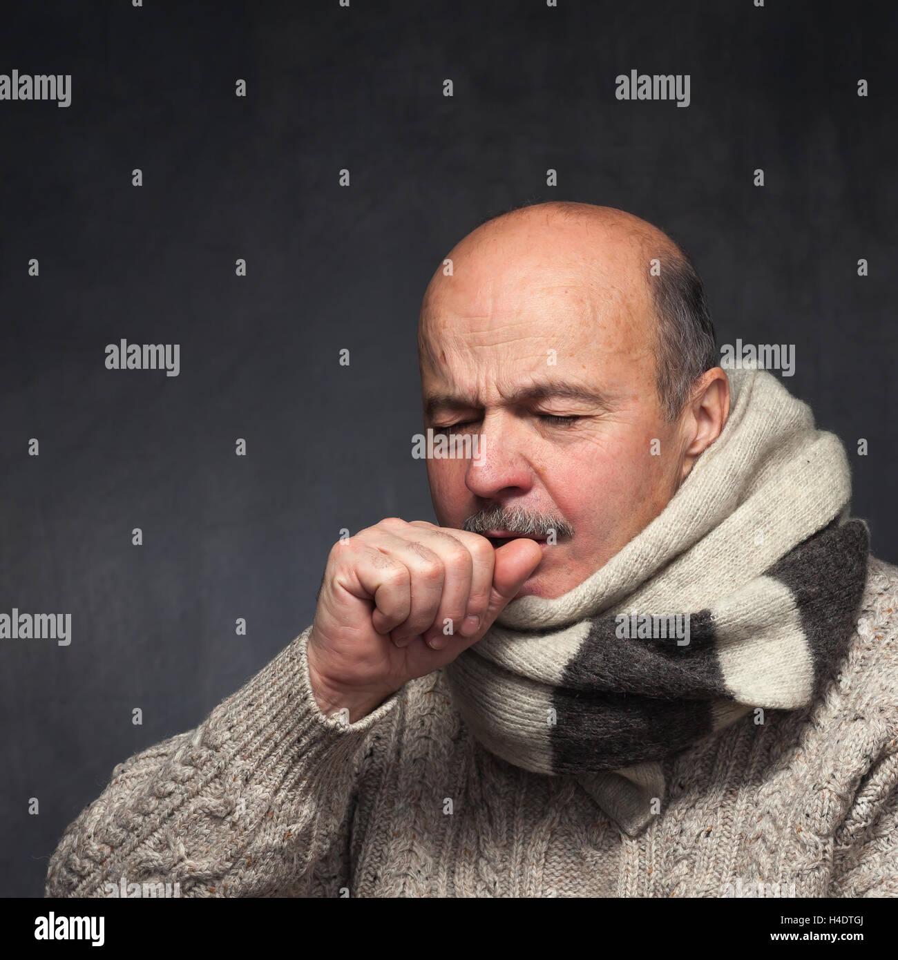 Elderly man is ill from colds or pneumonia. elderly man in a sweater ...
