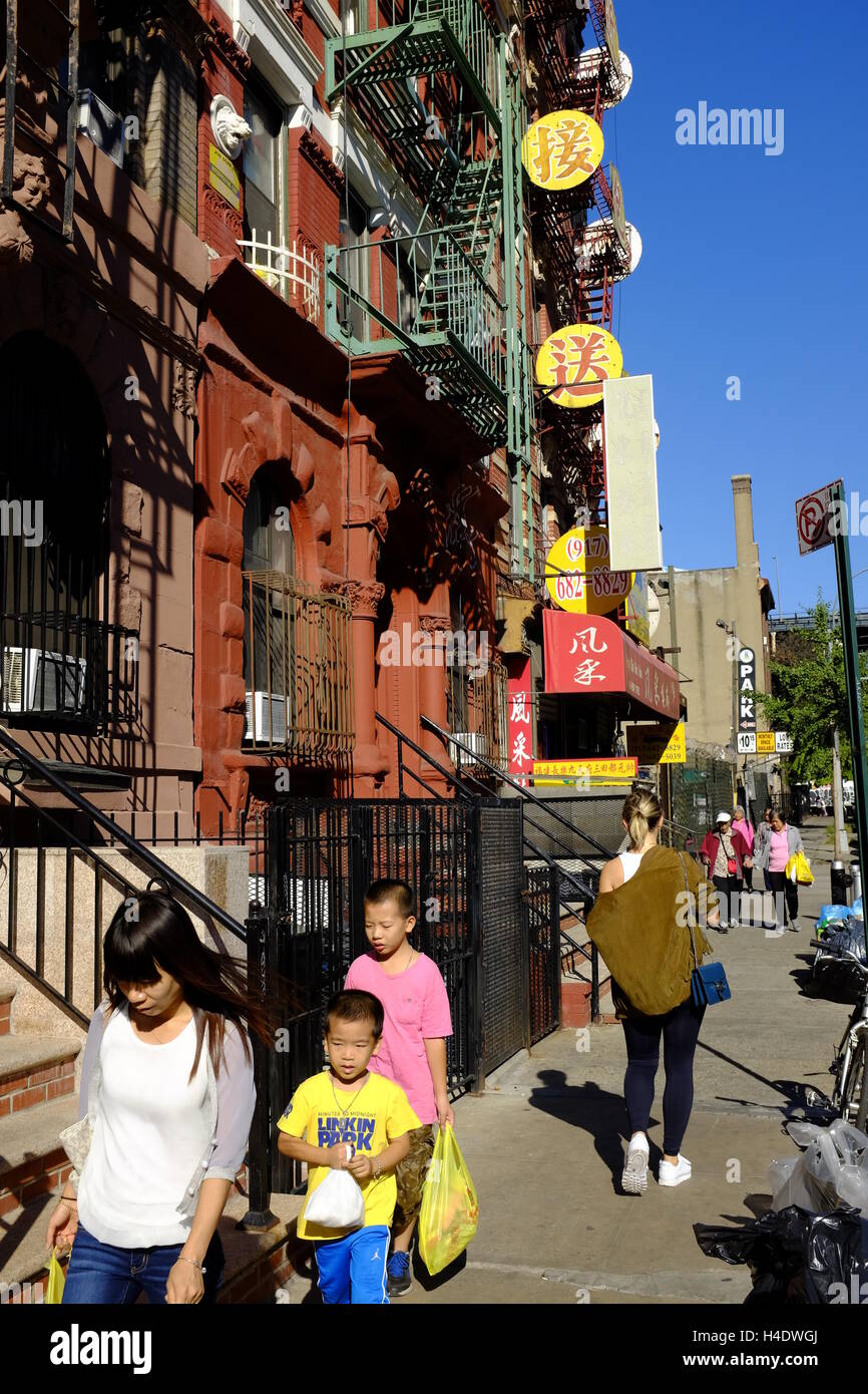 Chinese immigrants on the street of Manhattan Chinatown.New York City ...