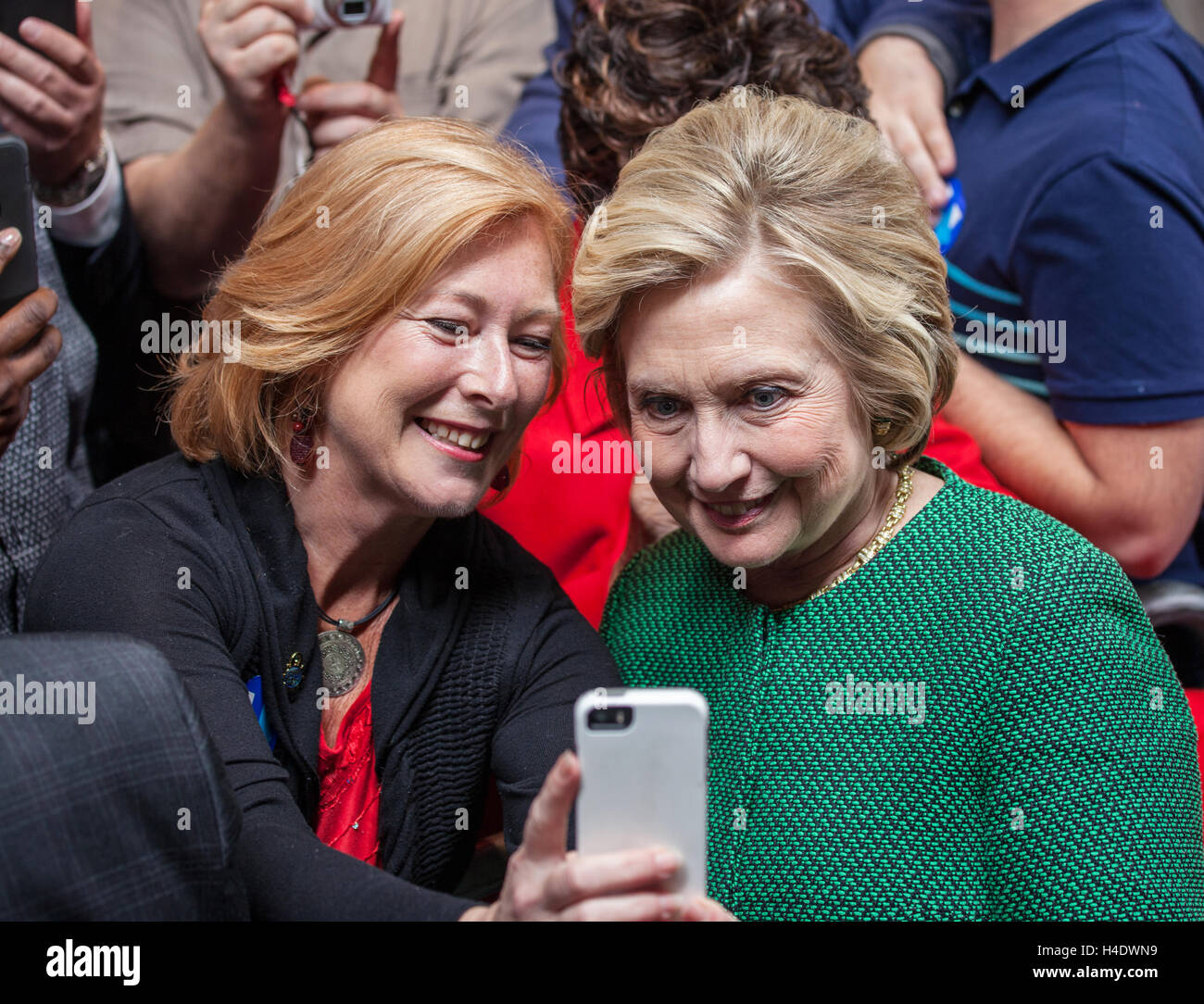 Hillary Clinton taking selfies and photos with supporters at a ...