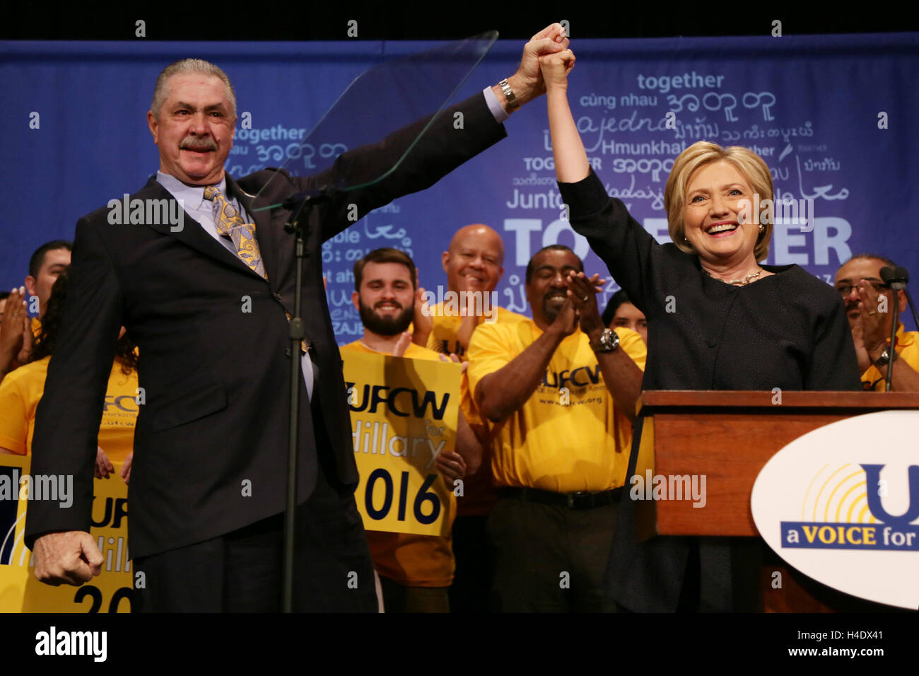 U.S. Democratic presidential candidate Hillary Clinton (R) poses with ...