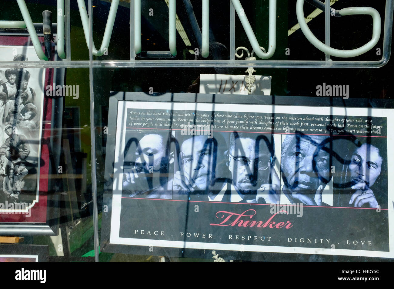 Posters of famous black thinkers display in a store window in Harlem ...