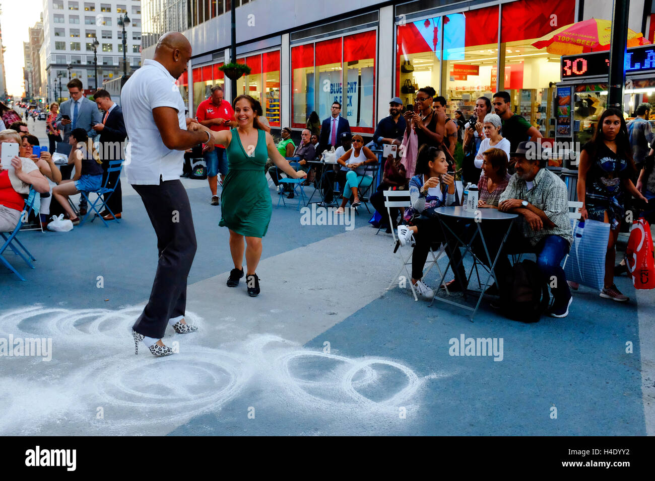 People dancing Salsa on the street next to Madison Square Garden ...