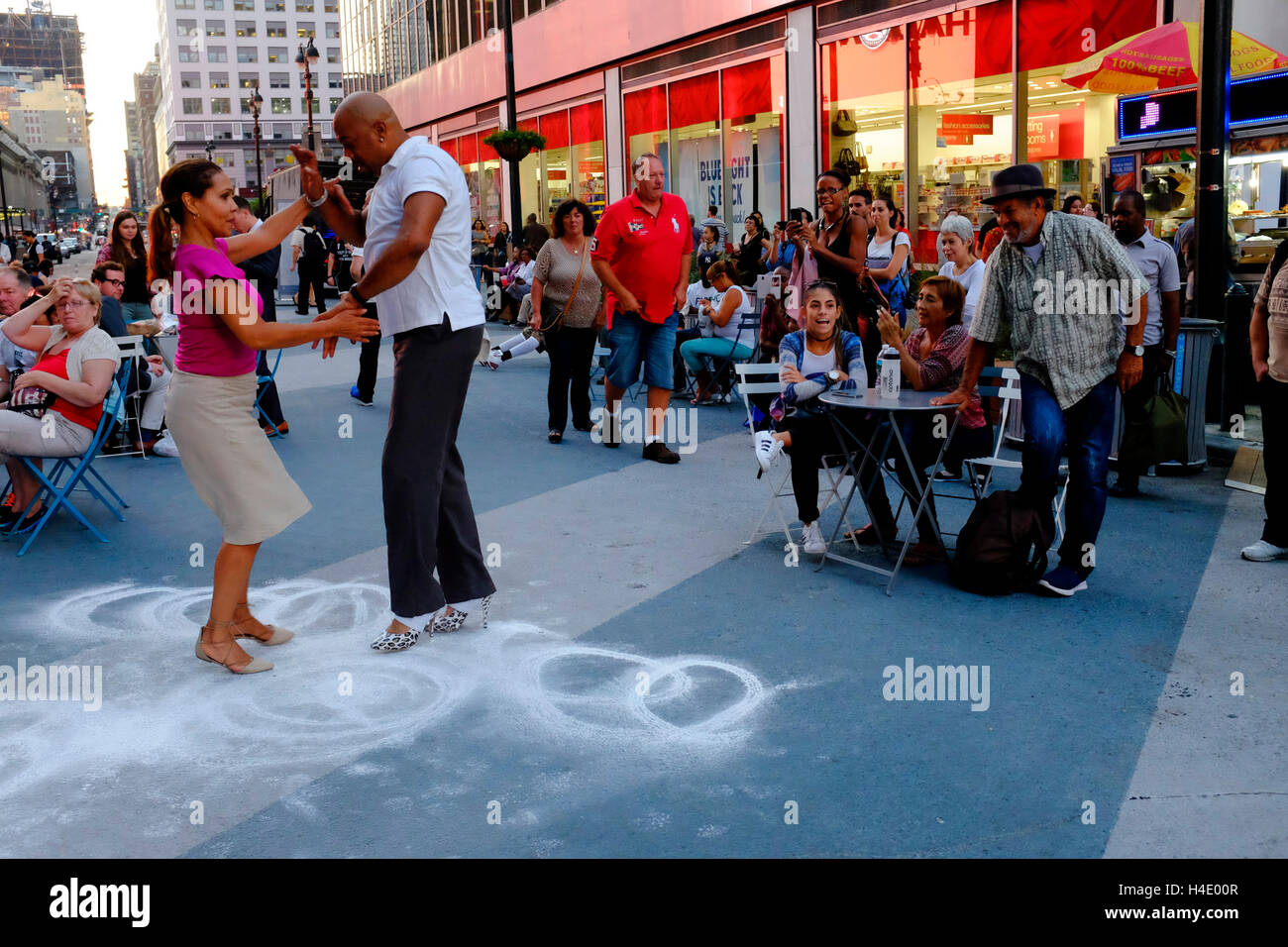 People dancing Salsa on the street next to Madison Square Garden ...