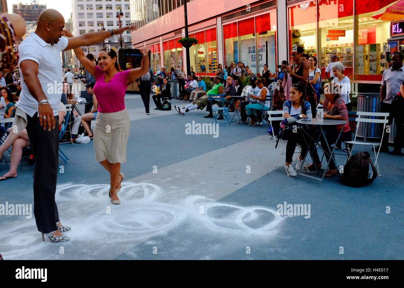 People dancing Salsa on the street next to Madison Square Garden ...