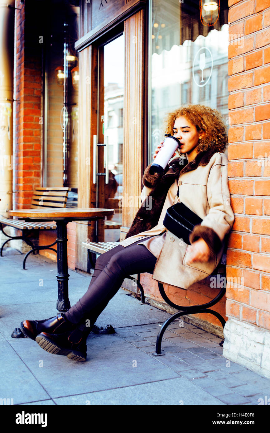 young pretty african american women drinking coffee outside in c Stock ...