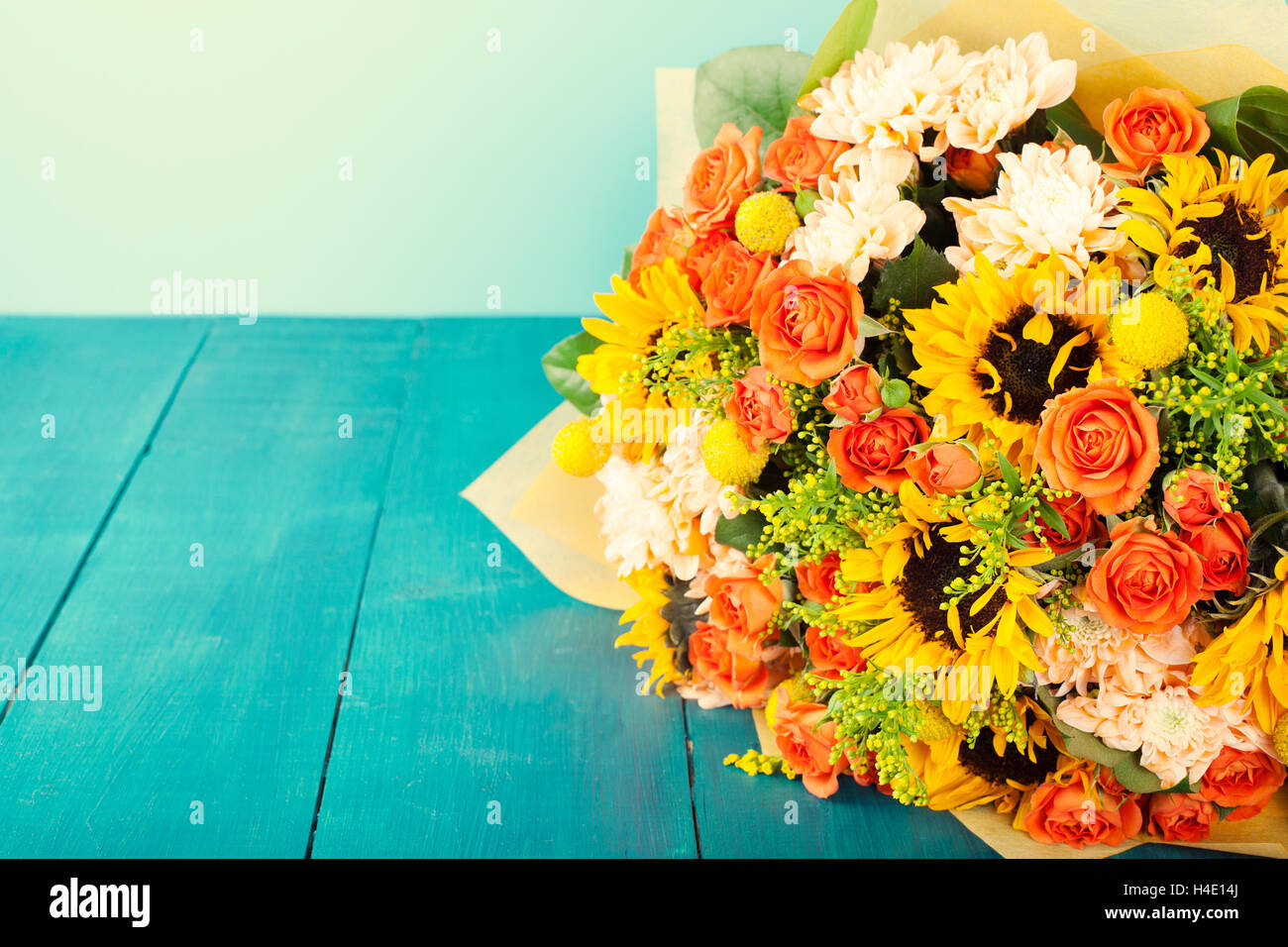 Colorful bouquet of flowers Turquoise wooden table Stock Photo - Alamy