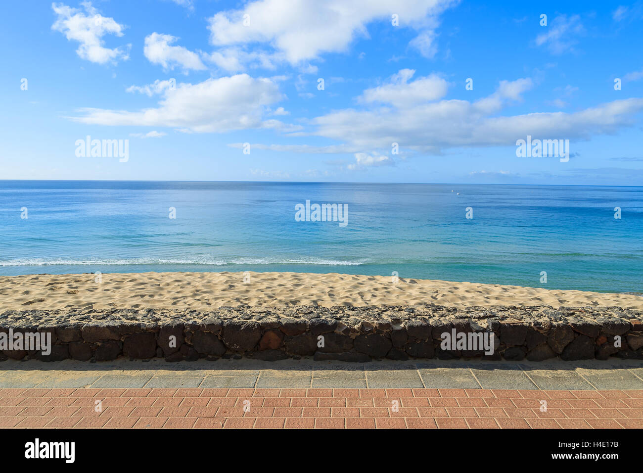 Sea and beach view from walkway on Morro Jable promenade on Jandia ...