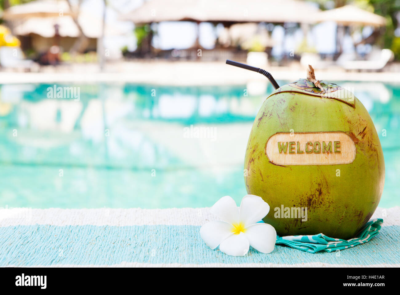 Green coconut with carving welcome Stock Photo - Alamy