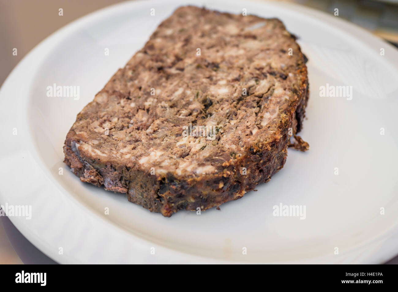 rabbit pate in white plate Stock Photo - Alamy