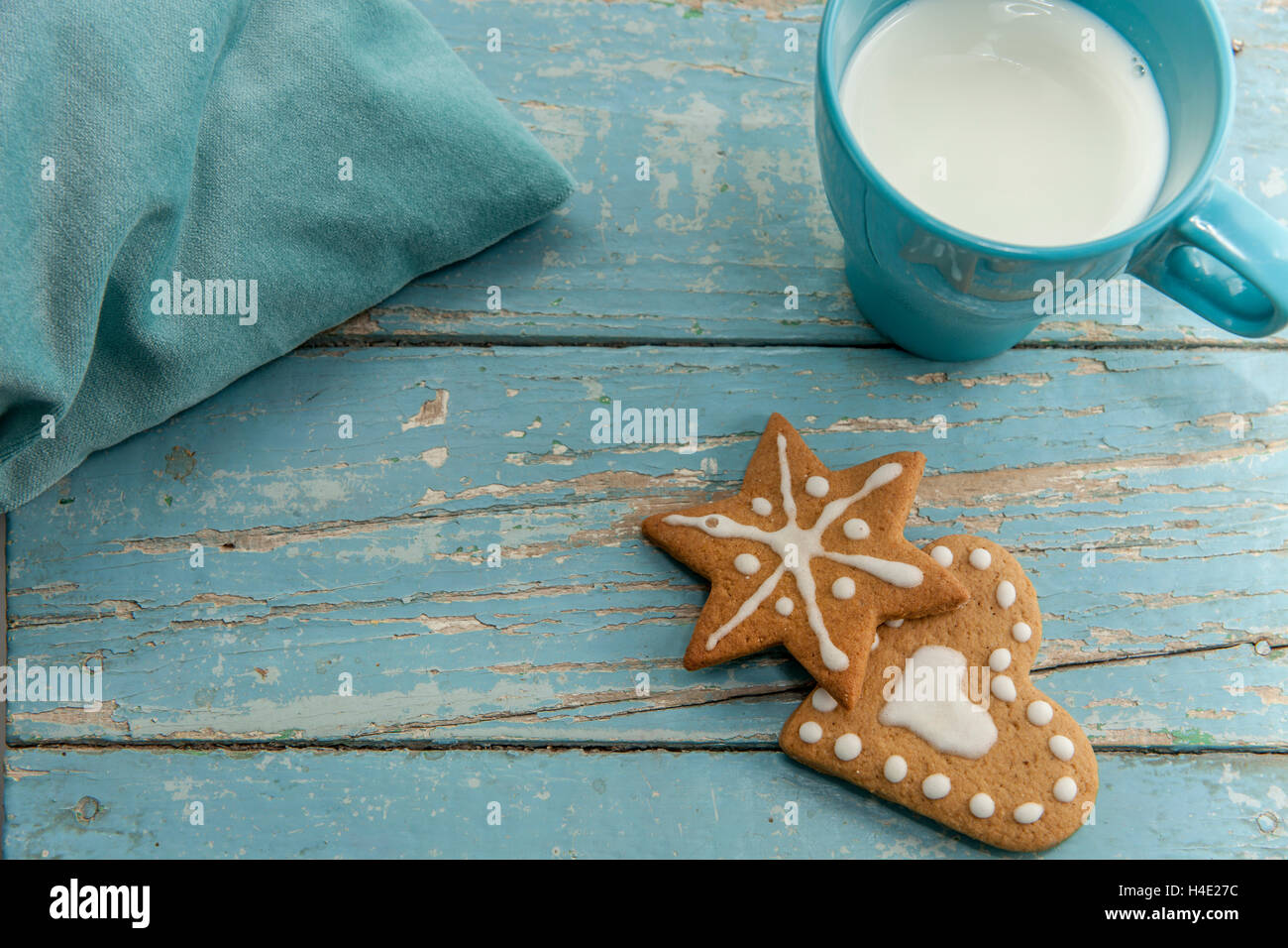 Gingerbread handmade winter cookies on a blue wooden background with a ...