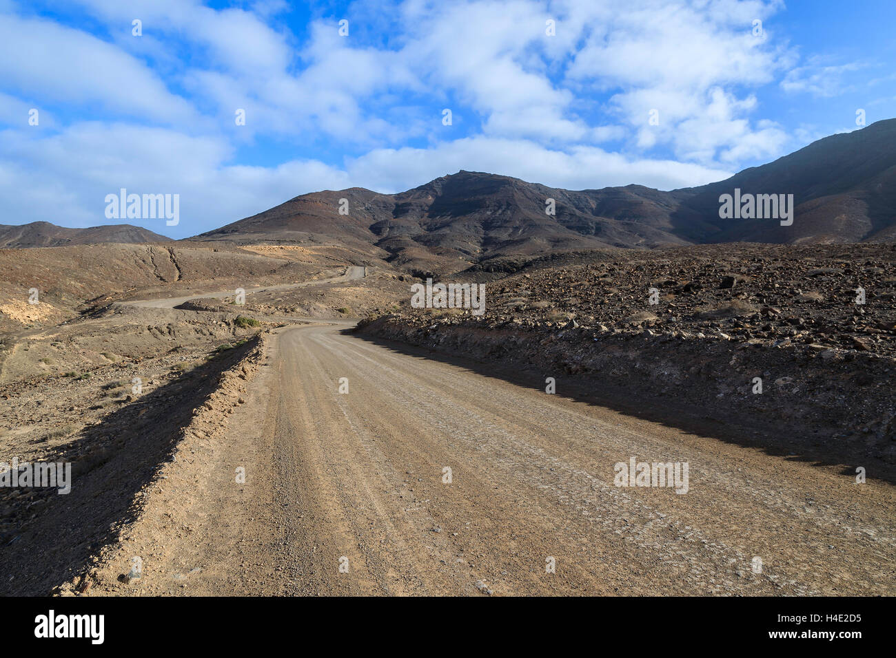 Unpaved road to Cofete beach from Morro Jable town and volcanic ...