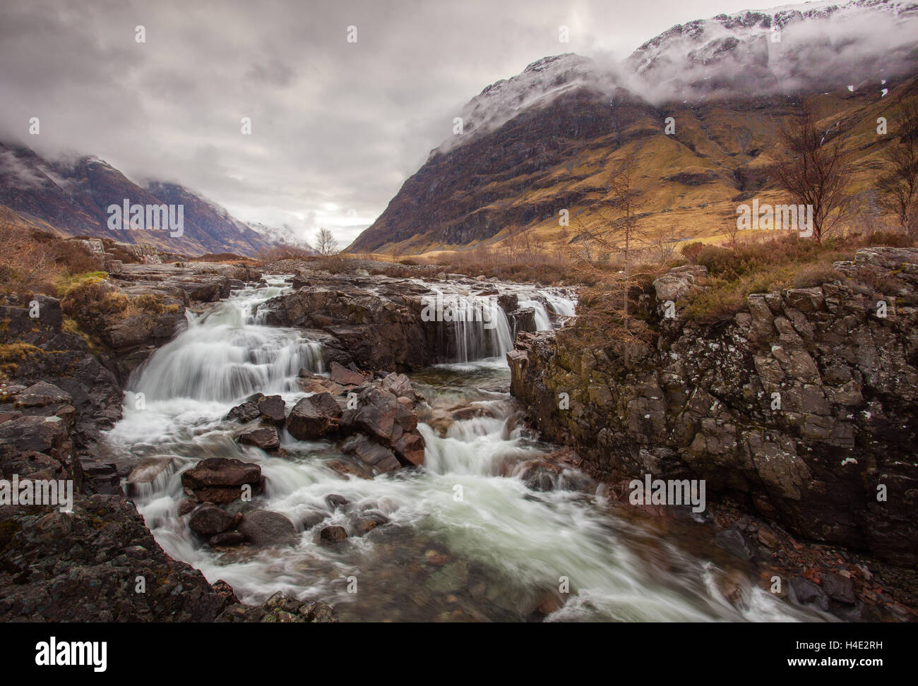 River Coe lower waterfall, Glencoe, with smoking clouds lingering over ...
