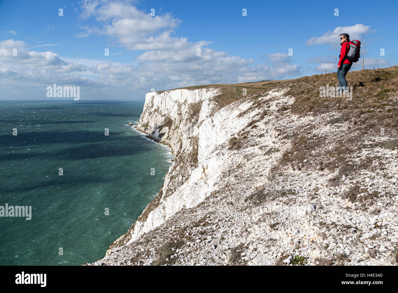 Walker on white chalk cliffs on Tennyson Down, Isle of Wight, UK Stock ...