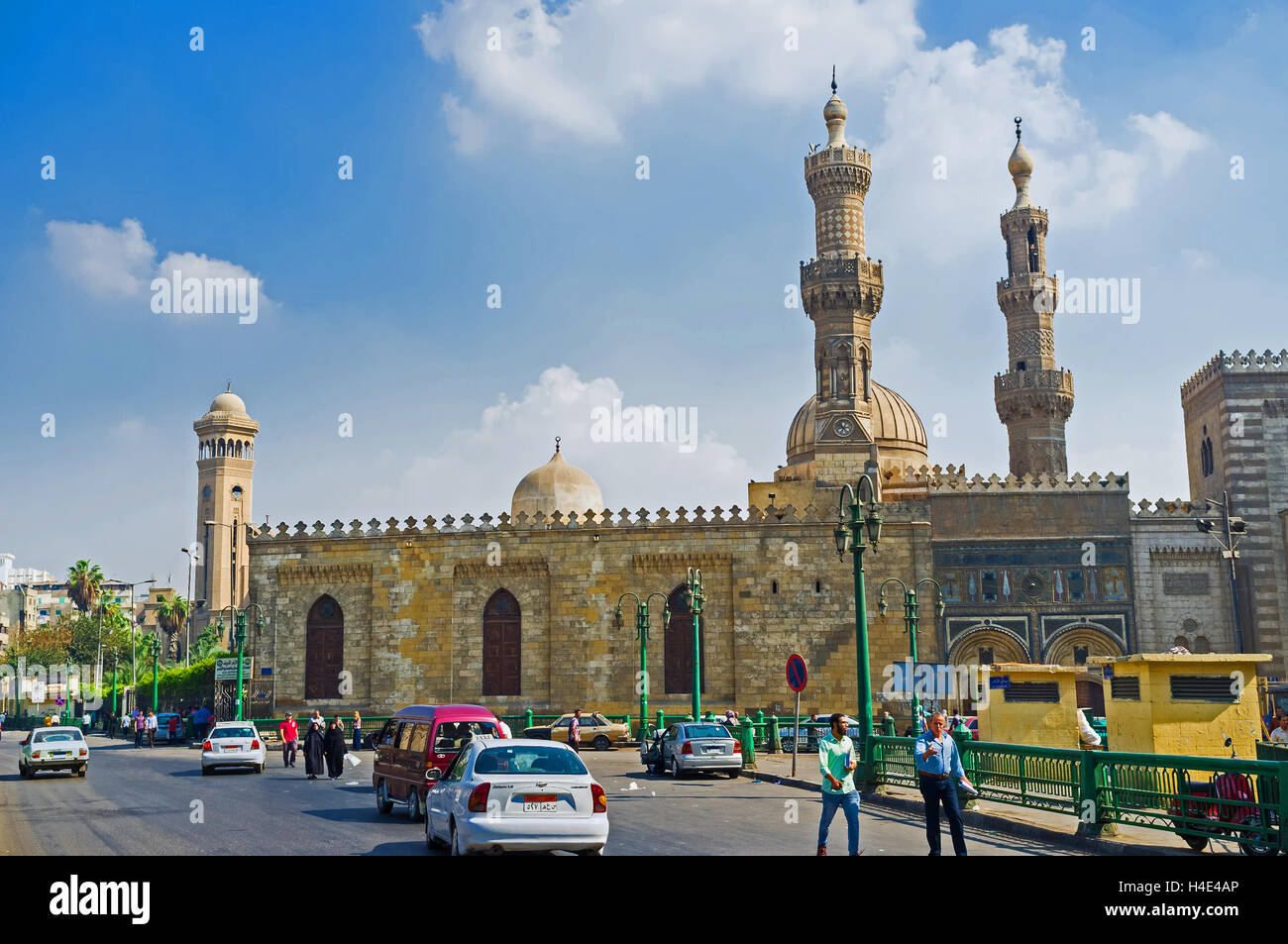 The view on Al-Azhar Mosque with its carved stone minarets and richly ...