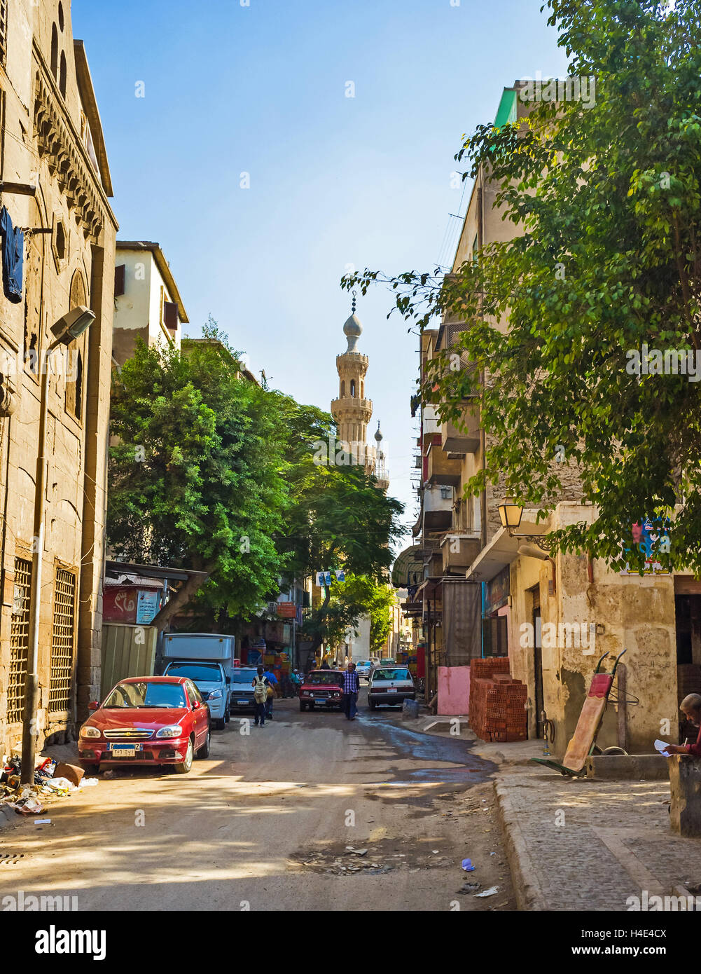 The old street with the carved minarets on the background, Cairo Egypt ...