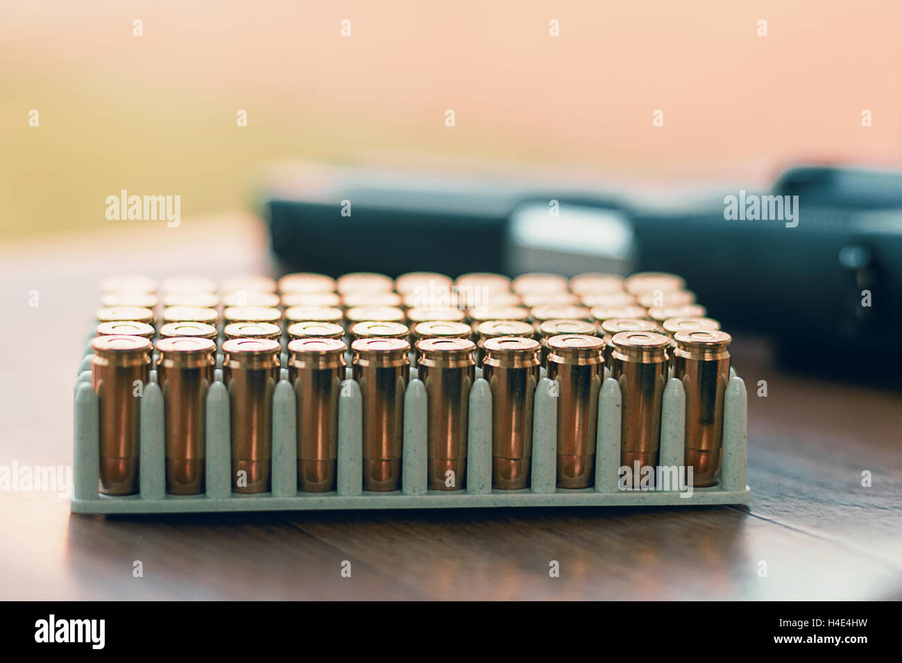 Gun with bullets. Handgun box with new ammunition Stock Photo - Alamy