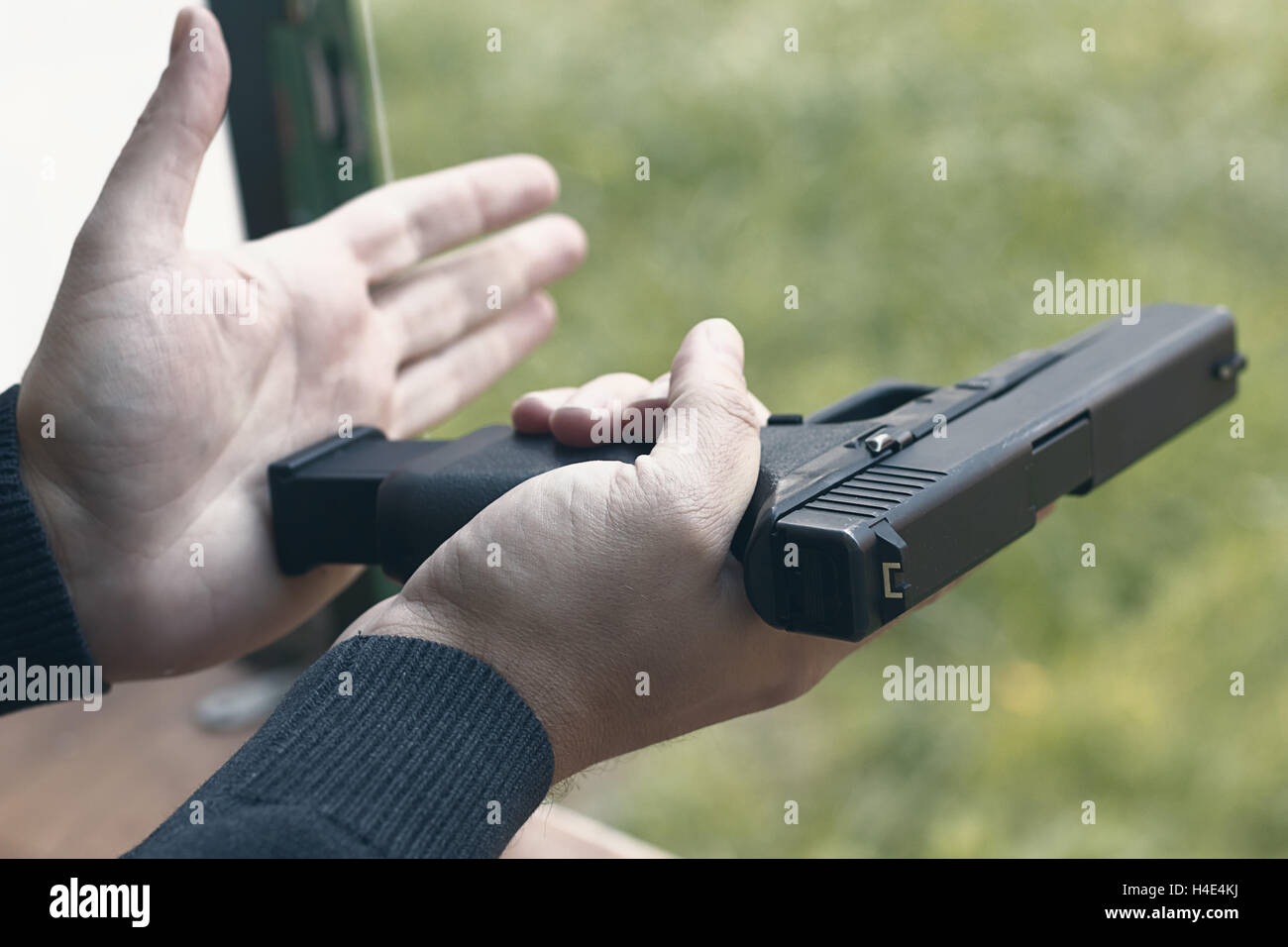 Loading Handgun. Reloading handgun Stock Photo - Alamy