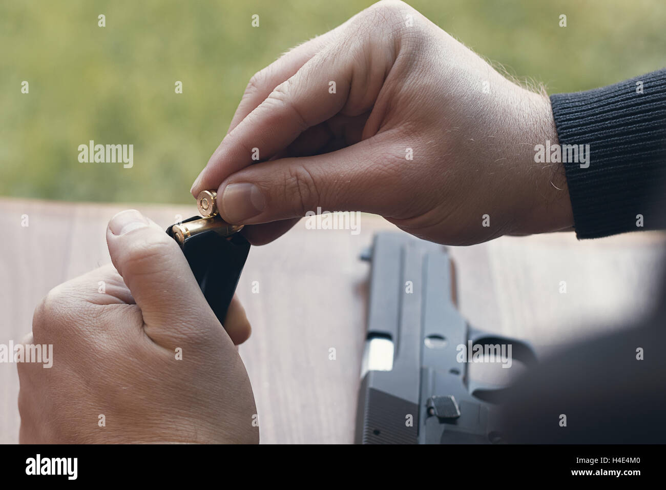 Loading a magazine. Loading Gun. Handgun magazine Stock Photo - Alamy