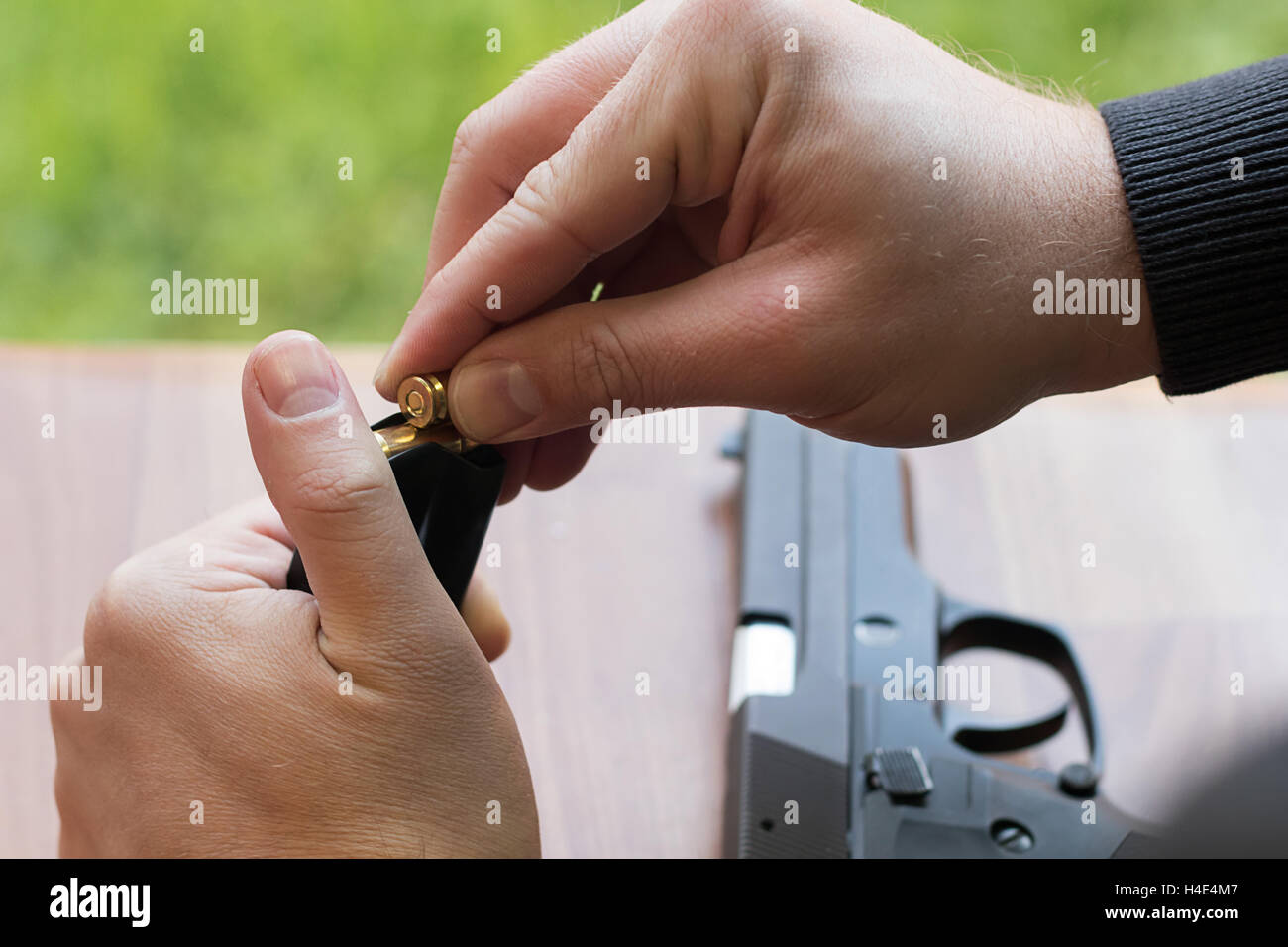 Loading a magazine loading gun handgun magazine hi-res stock ...