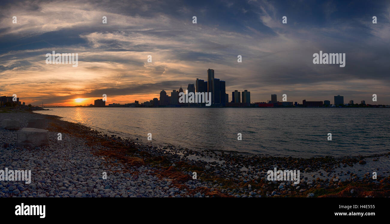 Panoramic view of Detroit skyline from river shoreline at sunset Stock ...