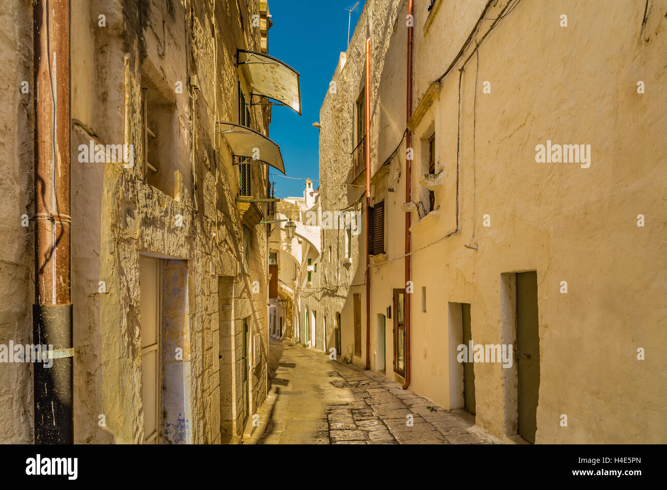 Narrow street of Ostuni, The White City Stock Photo - Alamy